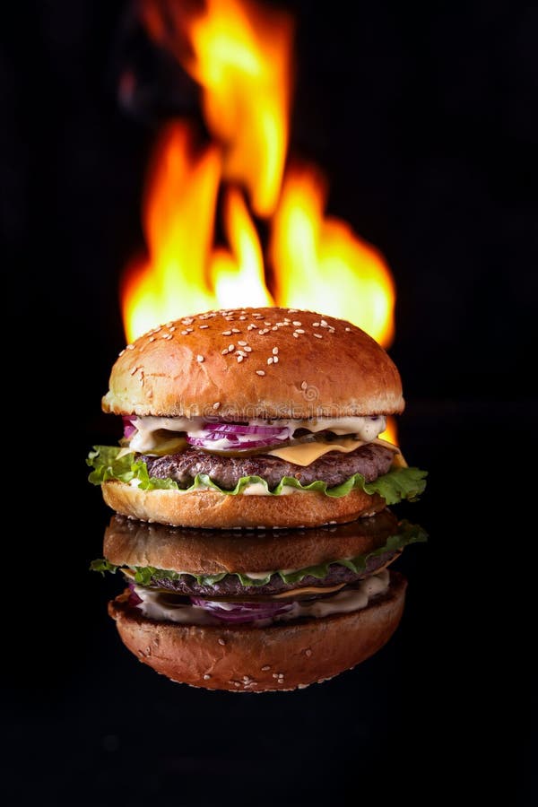 Burger with Fire on a Black Background for the Site3 Stock Photo ...