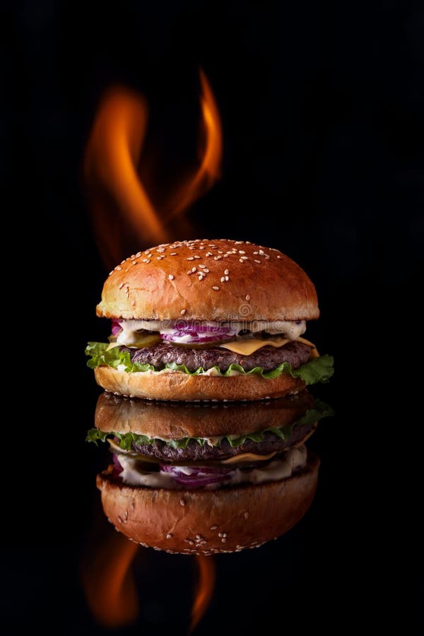 Burger with Fire on a Black Background for the Site3 Stock Photo ...