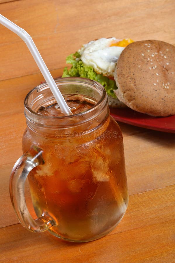 Burger and iced tea stock image. Image of grilled, beef - 69607797