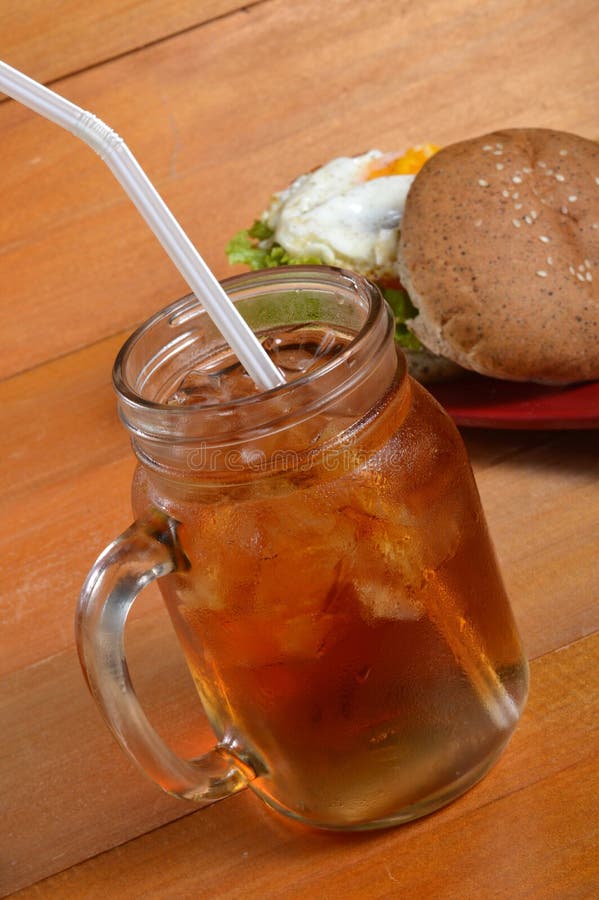 Burger and iced tea stock photo. Image of cheeseburger - 69607816