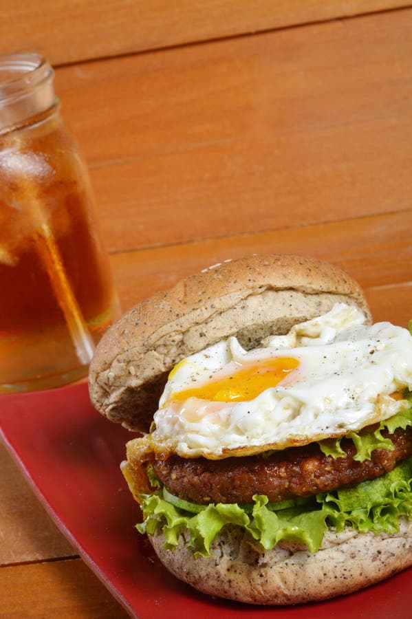 Burger and iced tea stock image. Image of black, grilled - 69607909
