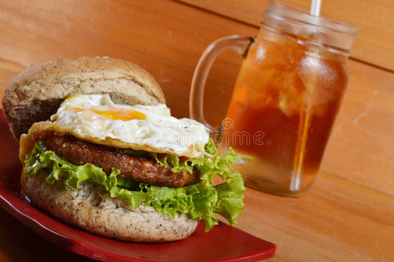 Burger and iced tea stock image. Image of liquid, beef - 69607929