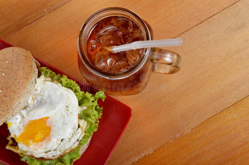 Burger and iced tea stock image. Image of glass, condensation - 69607983