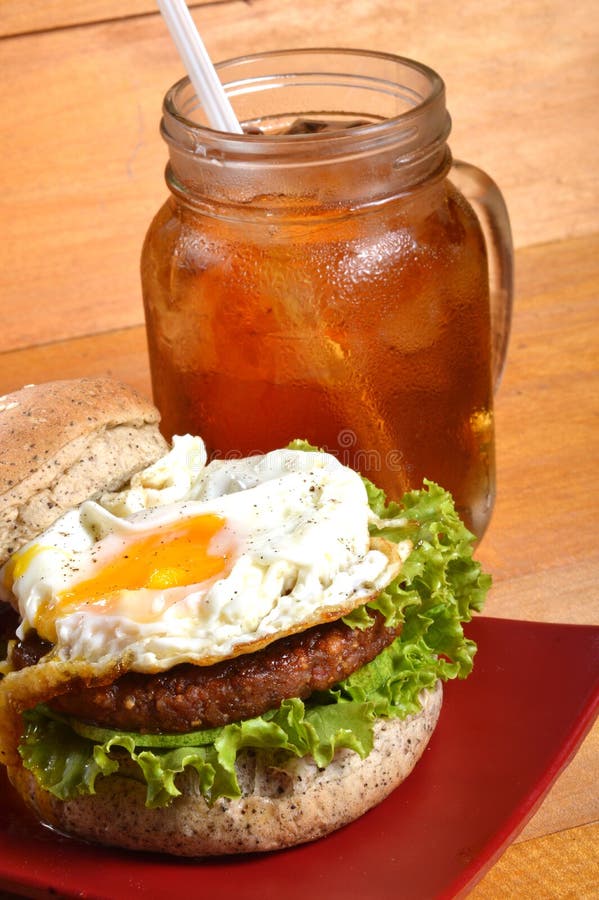 Burger and iced tea stock photo. Image of liquid, drink - 69608156
