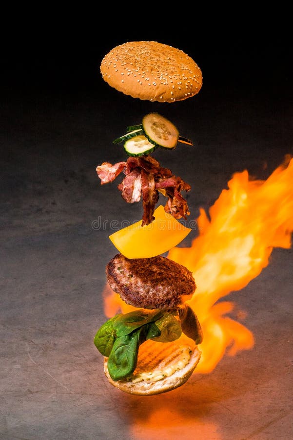 Burger Ingredients Levitating and Fire Stock Photo - Image of ...