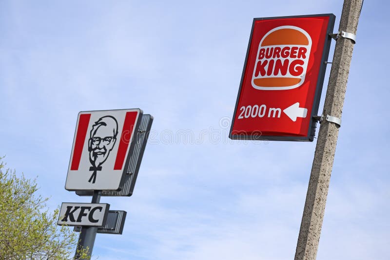 Burger King and KFC Signs on Poles Against Sky Editorial Photo - Image ...