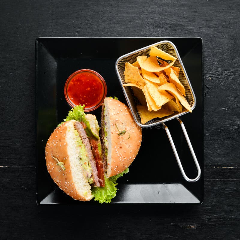 Burger with Meat and Snacks Nachos. in the Plate. Top View Stock Image ...