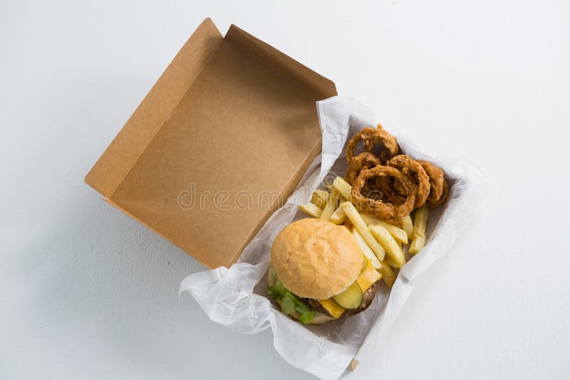 Burger with Onion Rings and French Fries in Box Stock Image - Image of ...