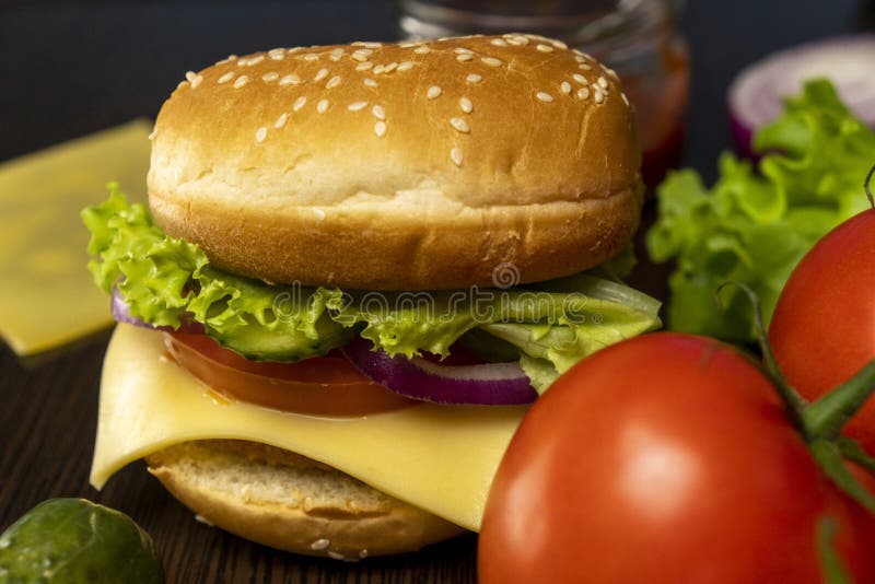 Burger and Tomatoes on the Table. Making Burgers at Home. Fast Food ...
