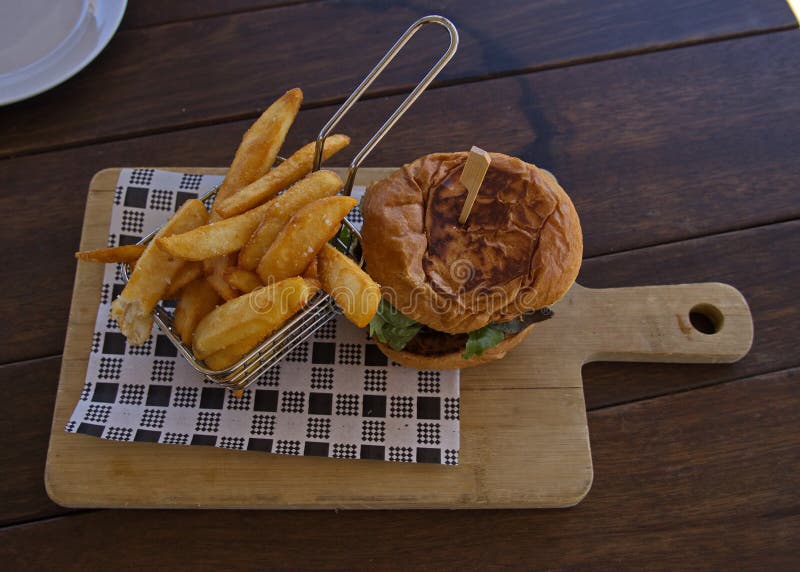 Burger with Wedges in a Restaurant Stock Image - Image of meal ...