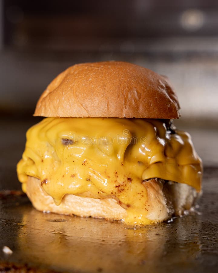 Burger with Yellow Cheese on the Griddle Stock Image - Image of meat ...