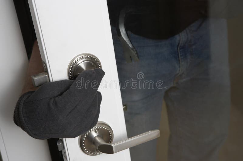 Burglar Breaking in To Home at Night through Back Stock Photo - Image ...