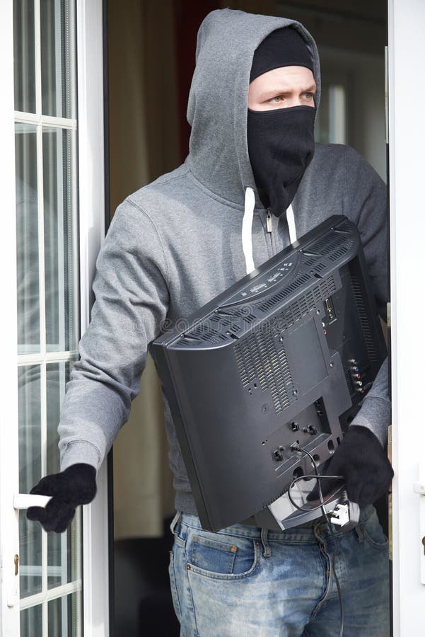 Burglar Stealing Items from Bedroom during House Break in Stock Photo ...