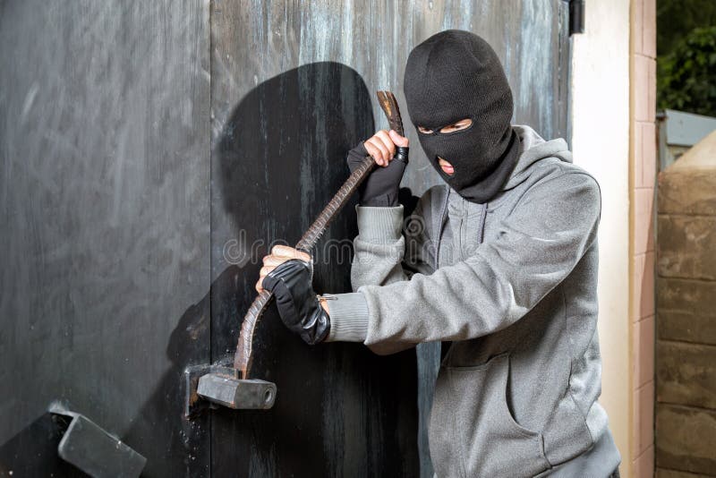 Burglar Breaks Lock on Door Stock Image - Image of building, crowbar ...