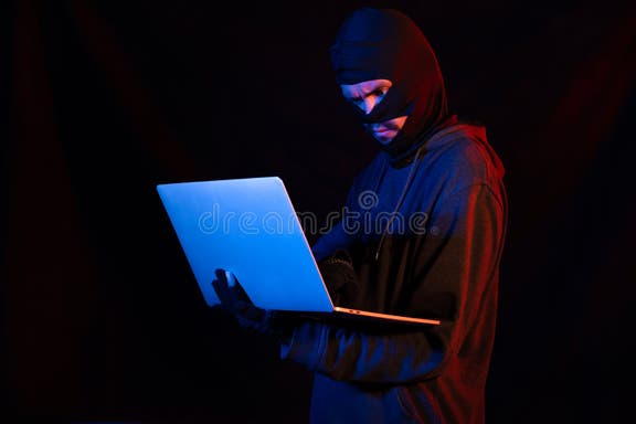 Burglar with Computer - Isolated on Black Stock Photo - Image of crime ...