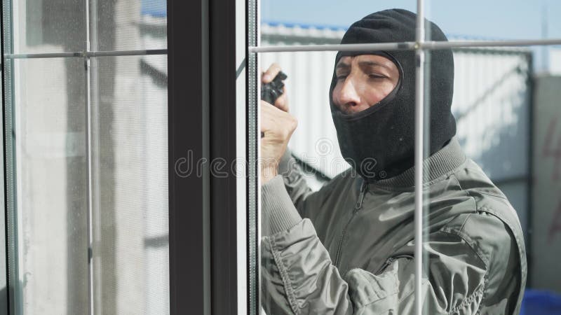 Thief Breaks a Window in a House Stock Video - Video of balaclava ...