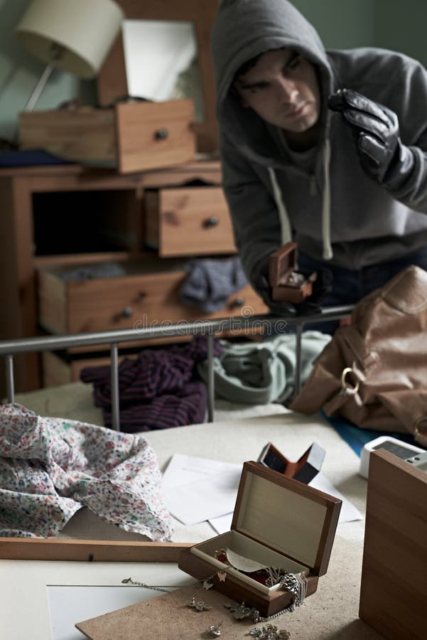 Burglar Stealing Items from Bedroom during House Break in Stock Photo ...