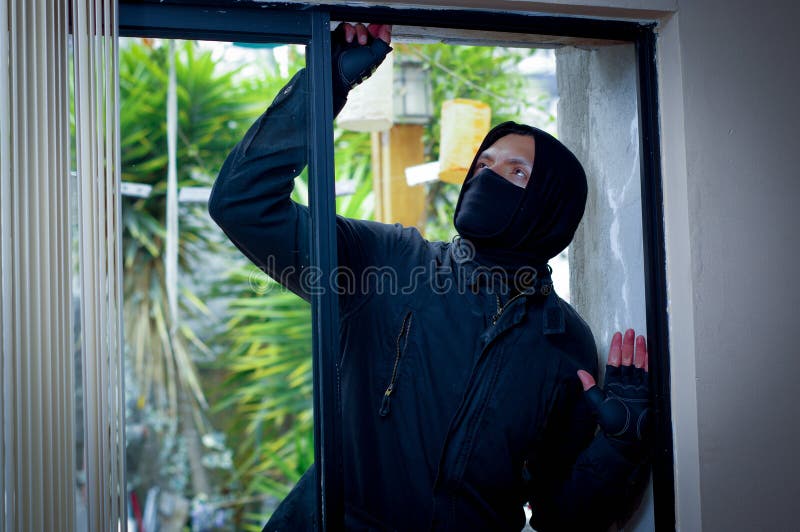 Burglar Trying Break the Window To Enter the House Stock Image - Image ...