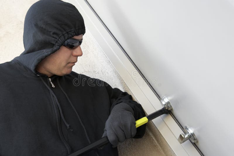 Burglar Using Crowbar To Break into House Stock Image - Image of hooded ...