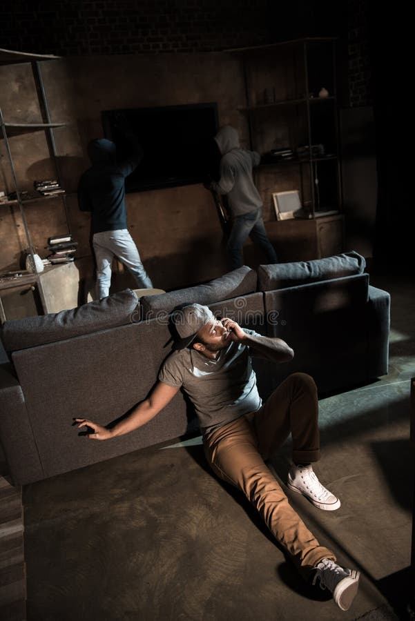 Burglars and scared man stock photo. Image of stealing - 93100524