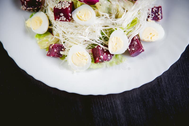 Buriak Salad, Greens and Perepelin?h Eggs, Sesame Stock Image - Image ...