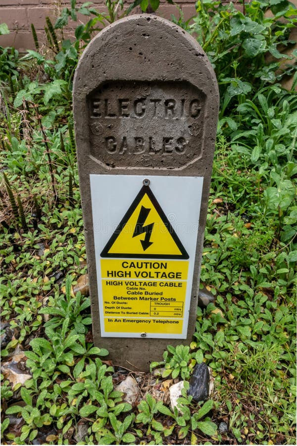 Buried Electric Cables Identification and Warning Post Stock Photo ...