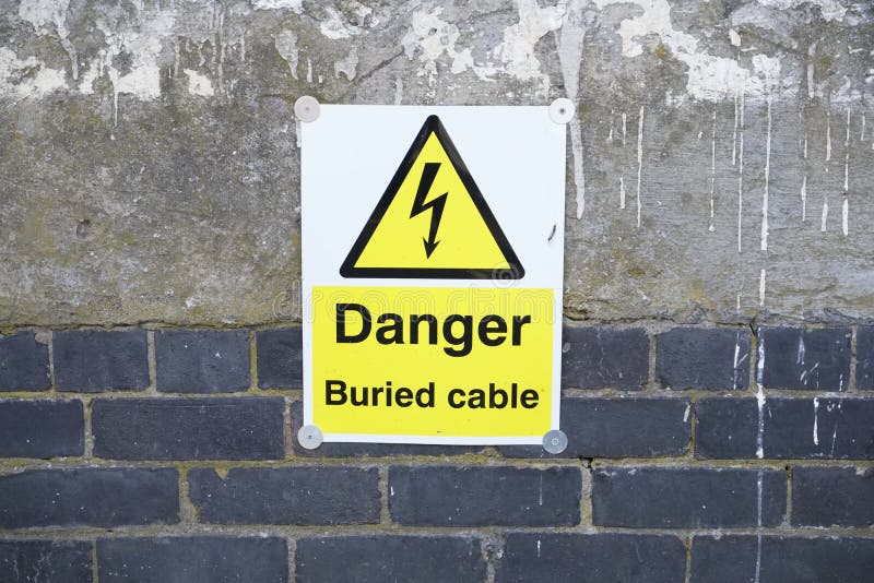Buried Electrical Cable Danger on Wall Stock Image - Image of civil ...