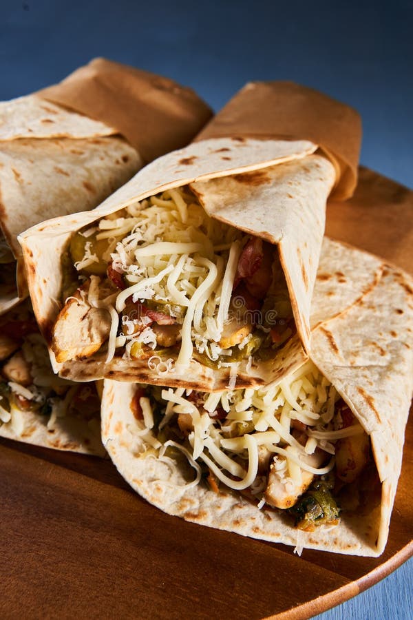 Burito roll wraps on blue stock photo. Image of tortilla - 266099396