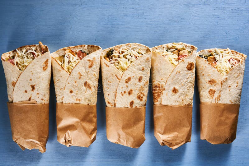 Burito roll wraps on blue stock photo. Image of mexican - 266099398