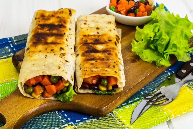Buritos for Mexican on Wooden Cutting Board Stock Photo - Image of ...