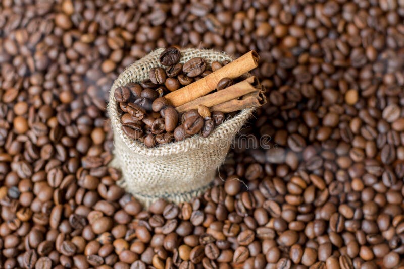 Burlap Bag with Cinnamon and Coffee Raw Beans and Smoke Stock Image ...