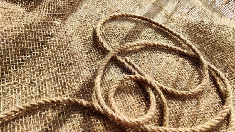 Burlap Fabric, Coarse Jute Weave, and Thick Burlap Rope. Background ...
