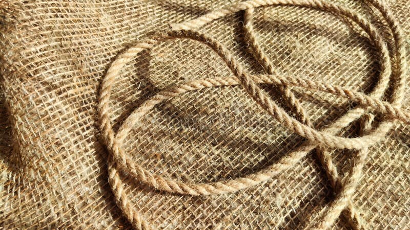 Burlap Fabric, Coarse Jute Weave, and Thick Burlap Rope. Background ...