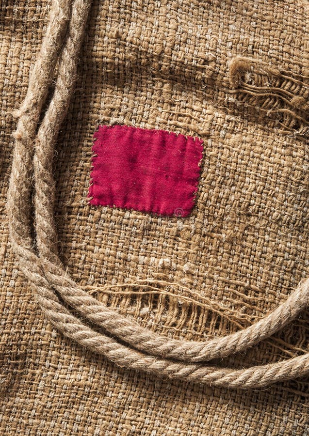 Burlap with red patch stock photo. Image of brown, flax - 84889512