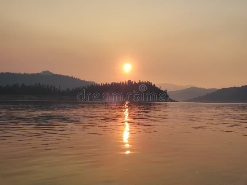 During the Burn with Fire Sunset Stock Photo - Image of sunset, lake ...