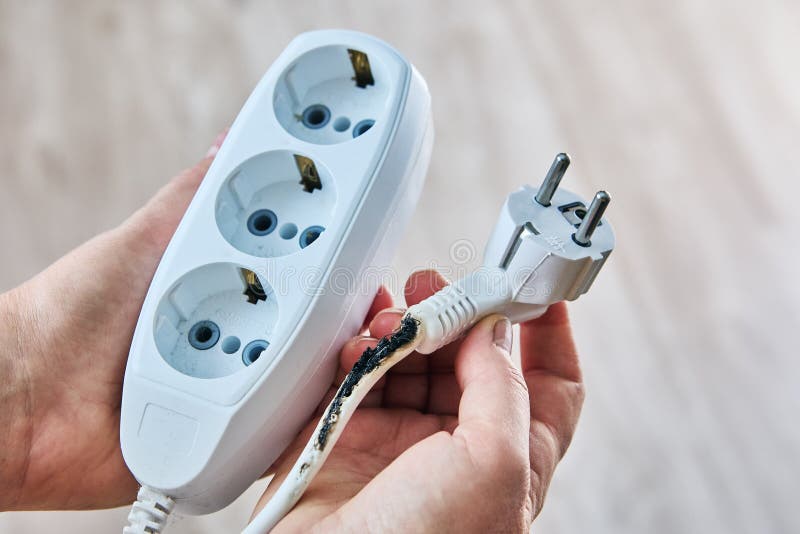 Burn Marks on Three Slot Electrical Extension Cord. Stock Photo - Image ...