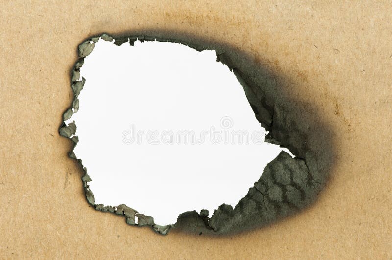 Burn Hole in a Piece of Paper Stock Photo - Image of damaged, hole ...