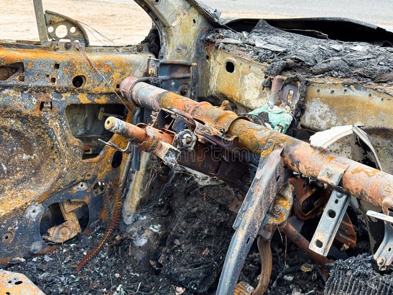 Burned Steering Column and Dashboard Frame from a Car Showing Rusted ...