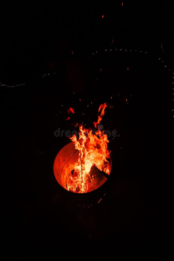 Burning Barrel with Jumping Sparks Flying Up in the Dark Stock Photo ...