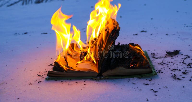 Burning Book in Snow. Pages with the Text in Open Book Burn with Bright ...