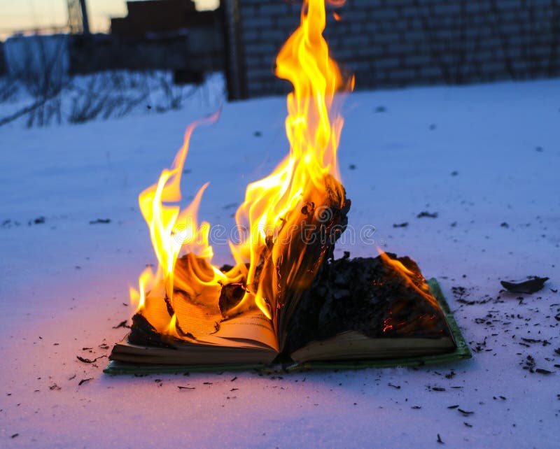Burning Book in Snow. Pages with the Text in Open Book Burn with Bright ...