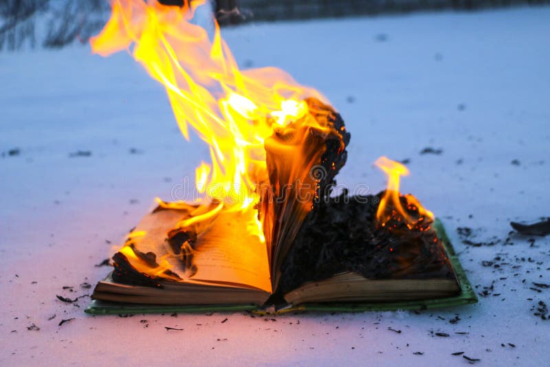 Burning Book in Snow. Pages with the Text in Open Book Burn with Bright ...