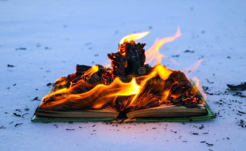 Burning Book in Snow. Pages with the Text in Open Book Burn with Bright ...