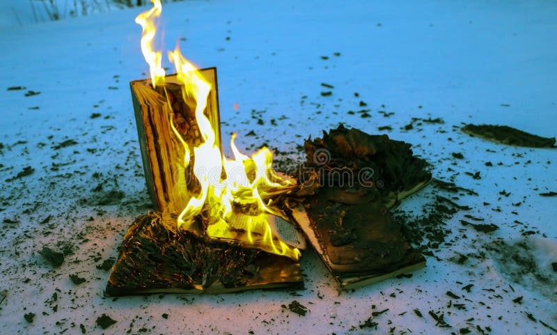 Burning Book in Snow. Pages with the Text in Open Book Burn with Bright ...