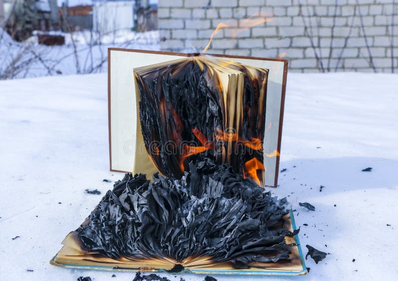 Burning Book in Snow. Pages with the Text in Open Book Burn with Bright ...