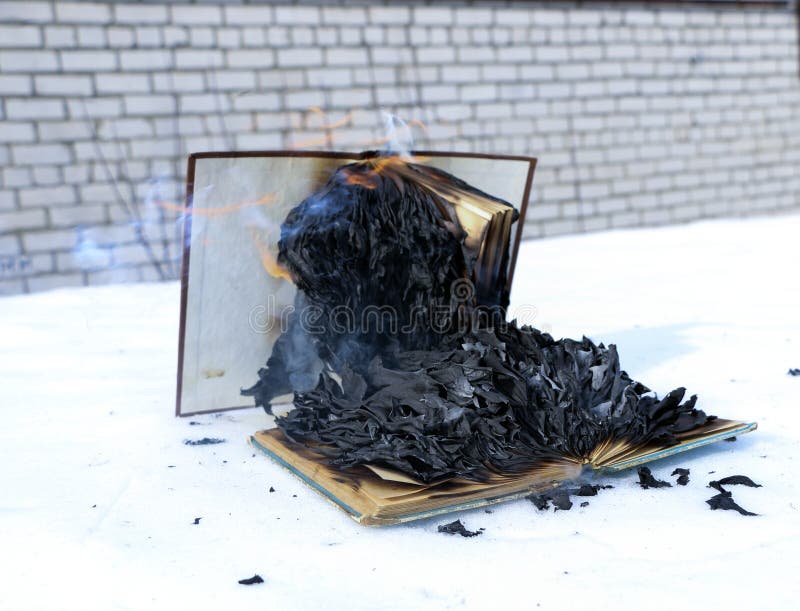 Burning Book in Snow. Pages with the Text in Open Book Burn with Bright ...