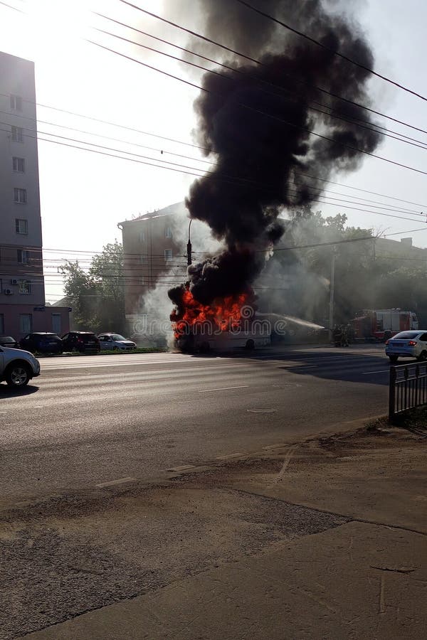 Burning bus in the city stock image. Image of factory - 387865777