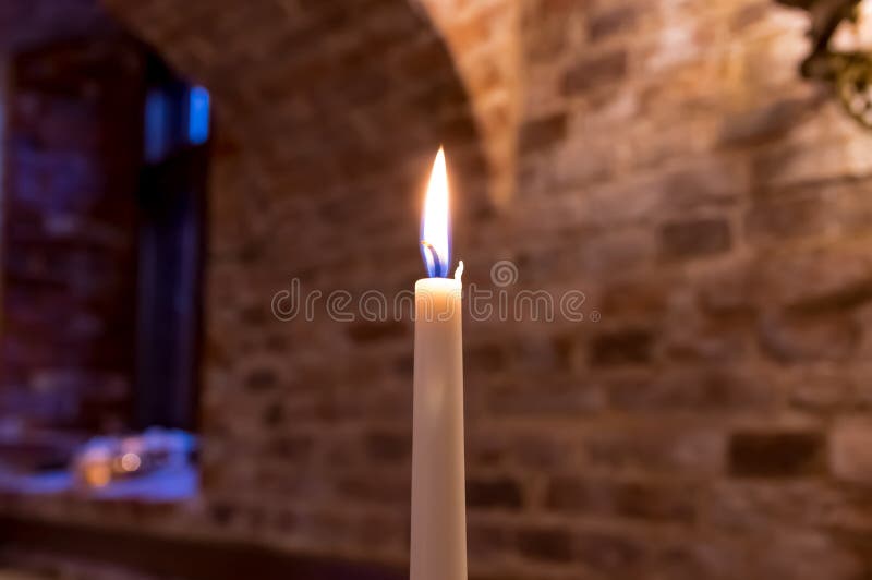 A Burning Candle in the Castle Stock Photo - Image of basement ...