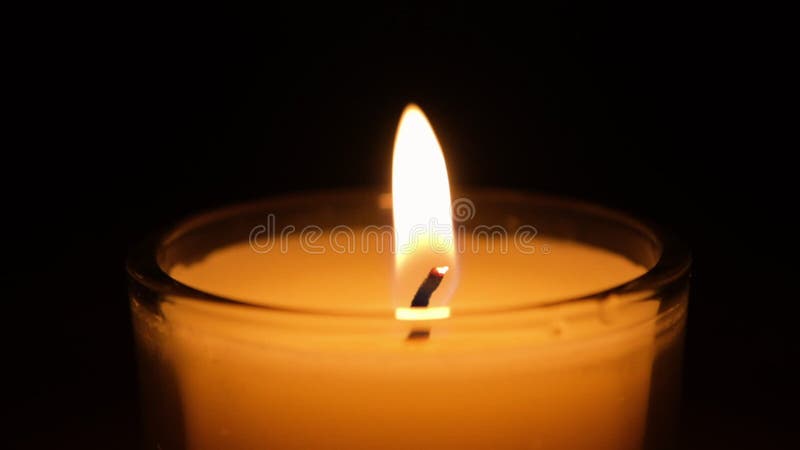 Burning Candle Close Up on a Black Background. Slow Motion Video Stock ...