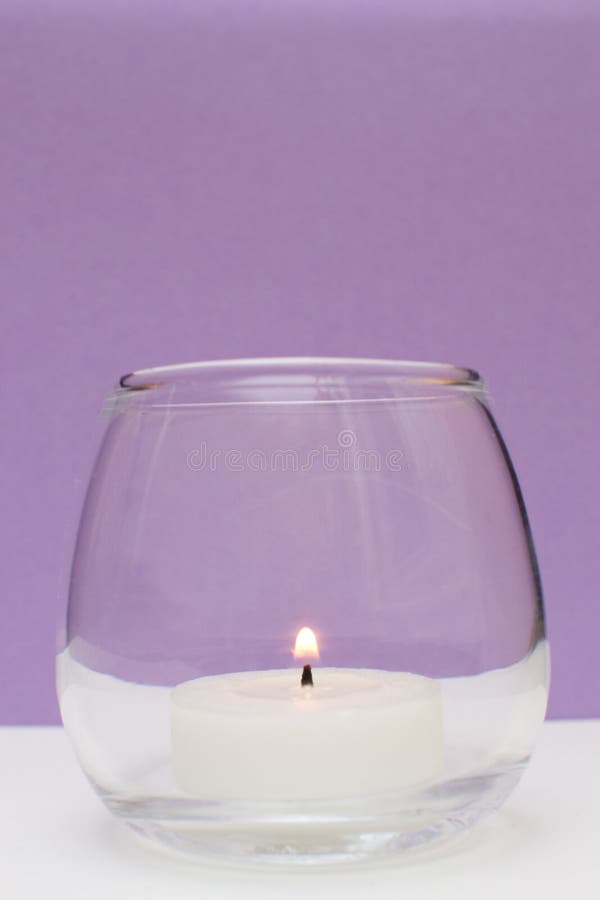 Burning Candle Front View, on Purple Stock Image - Image of lighting ...